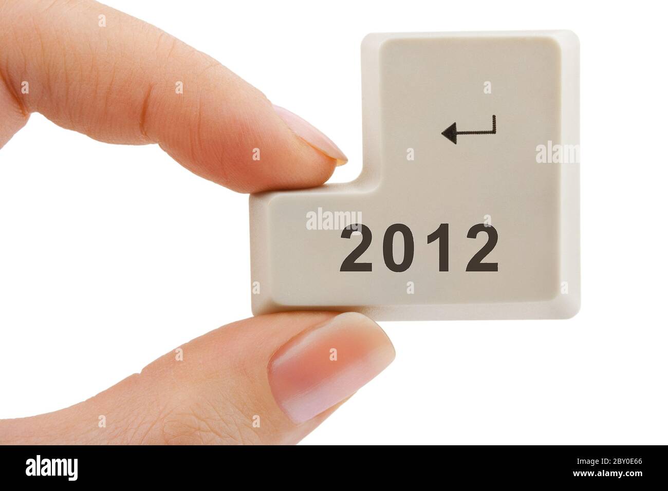 Computer button 2012 in hand Stock Photo - Alamy