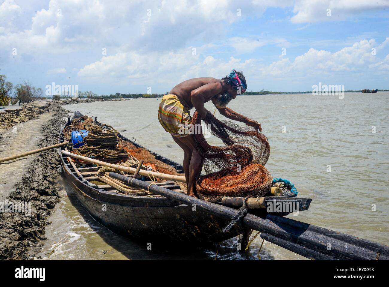 June 5, 2020, Satkhira, Bangladesh: A fisherman is seen preparing to ...
