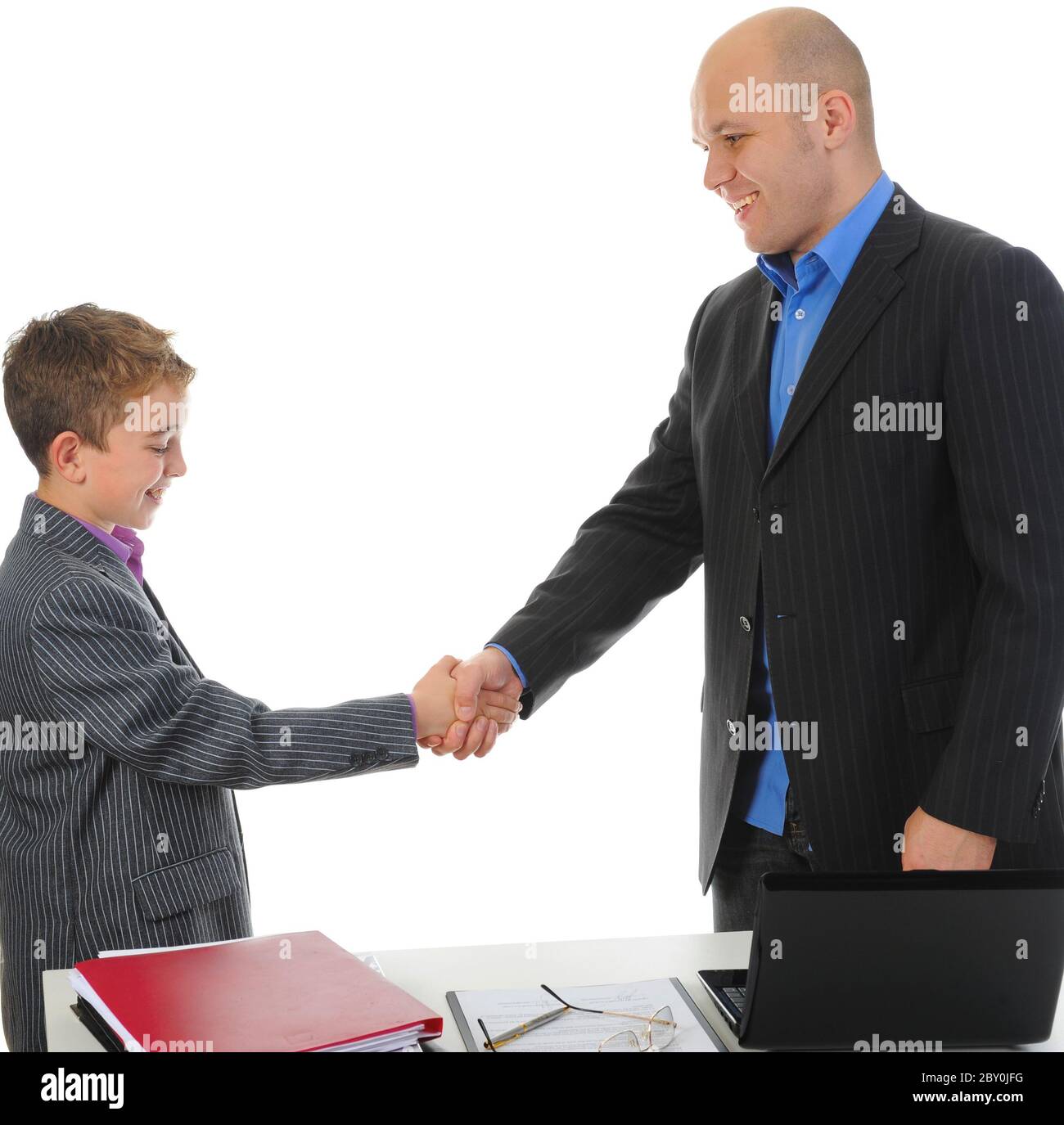 Handshake man and boy Stock Photo - Alamy