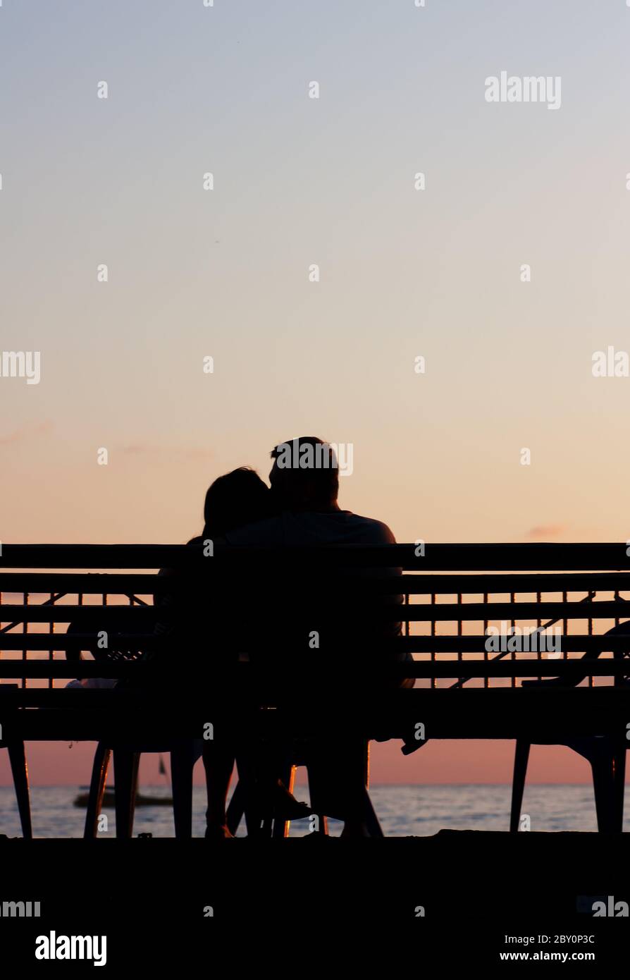 Romantic Couple at Sunset Stock Photo - Alamy