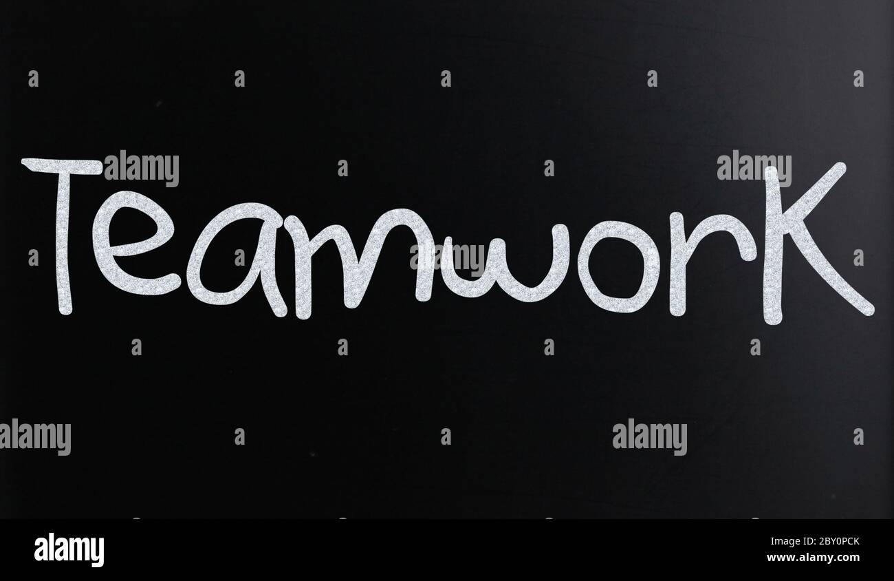 The word Teamwork handwritten with white chalk on a blackboard Stock ...