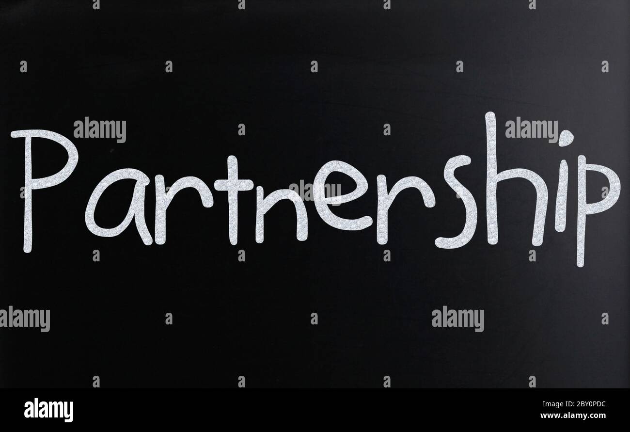 The word Partnership handwritten with white chalk on a blackboard Stock ...