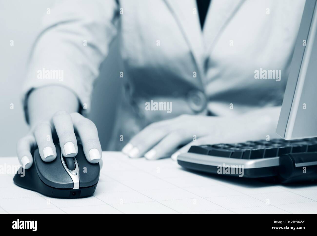 Female hand holding computer mouse Stock Photo - Alamy