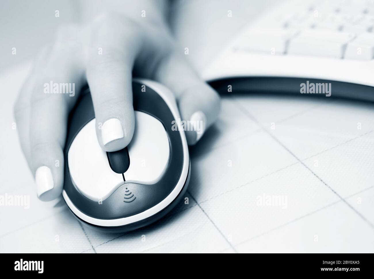 Female hand holding computer mouse Stock Photo - Alamy