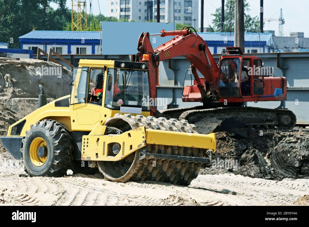 Steam roller and excavator Stock Photo - Alamy