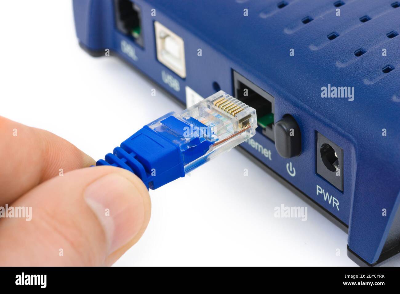 Internet cable in hand and modem Stock Photo - Alamy