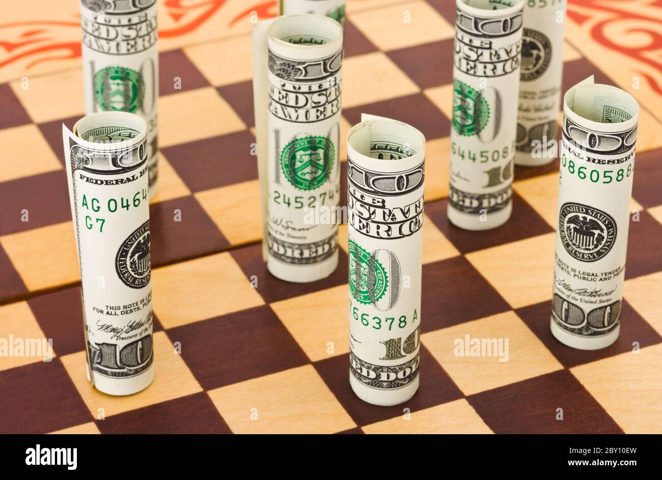 Money on chess board Stock Photo - Alamy