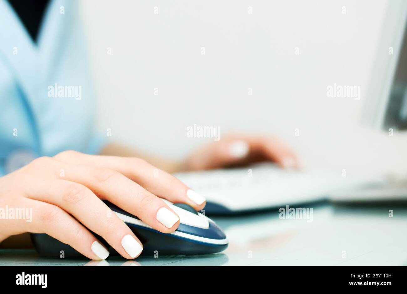 Female hands using computer Stock Photo - Alamy