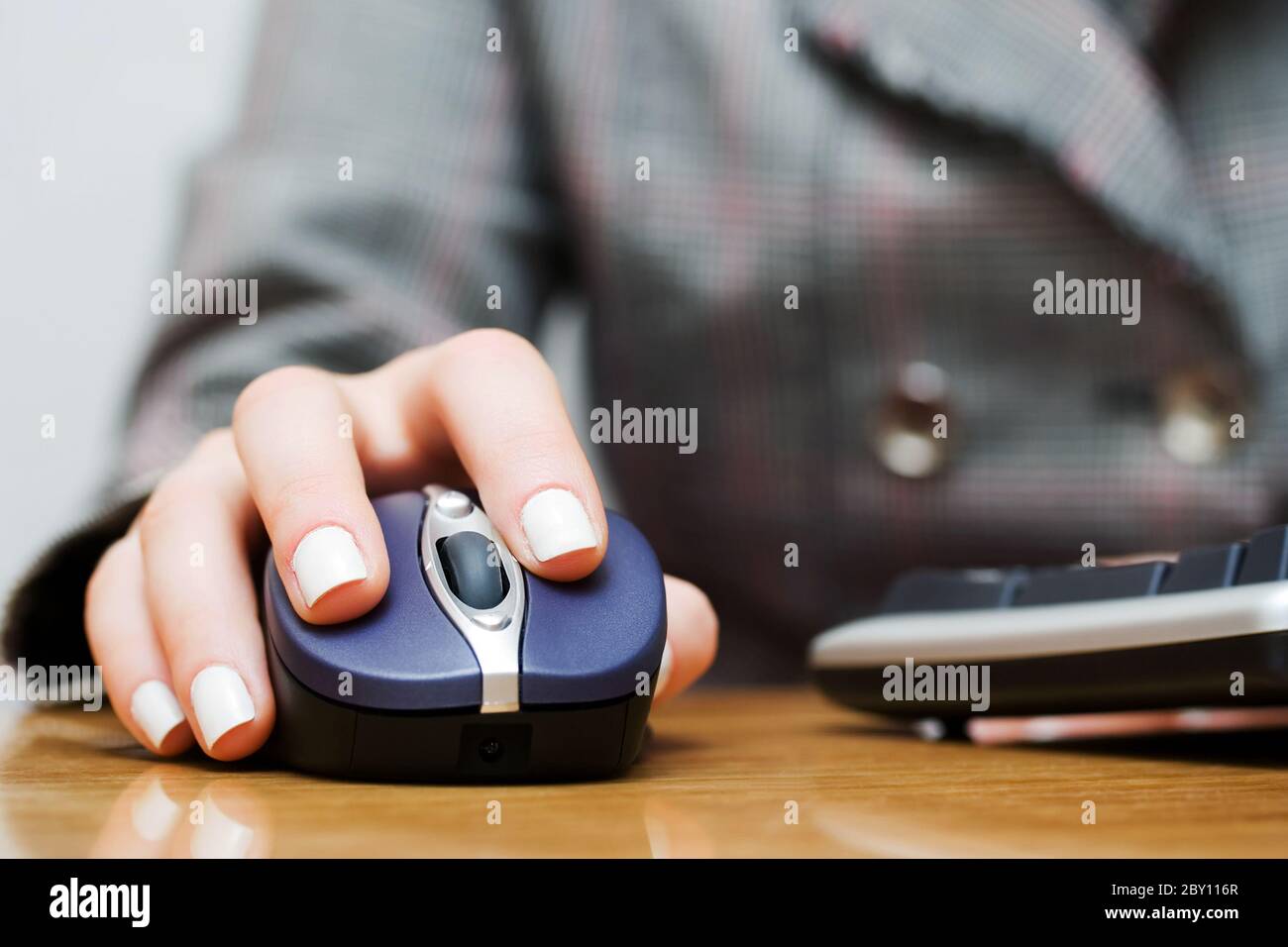 Female hand holding computer mouse Stock Photo - Alamy