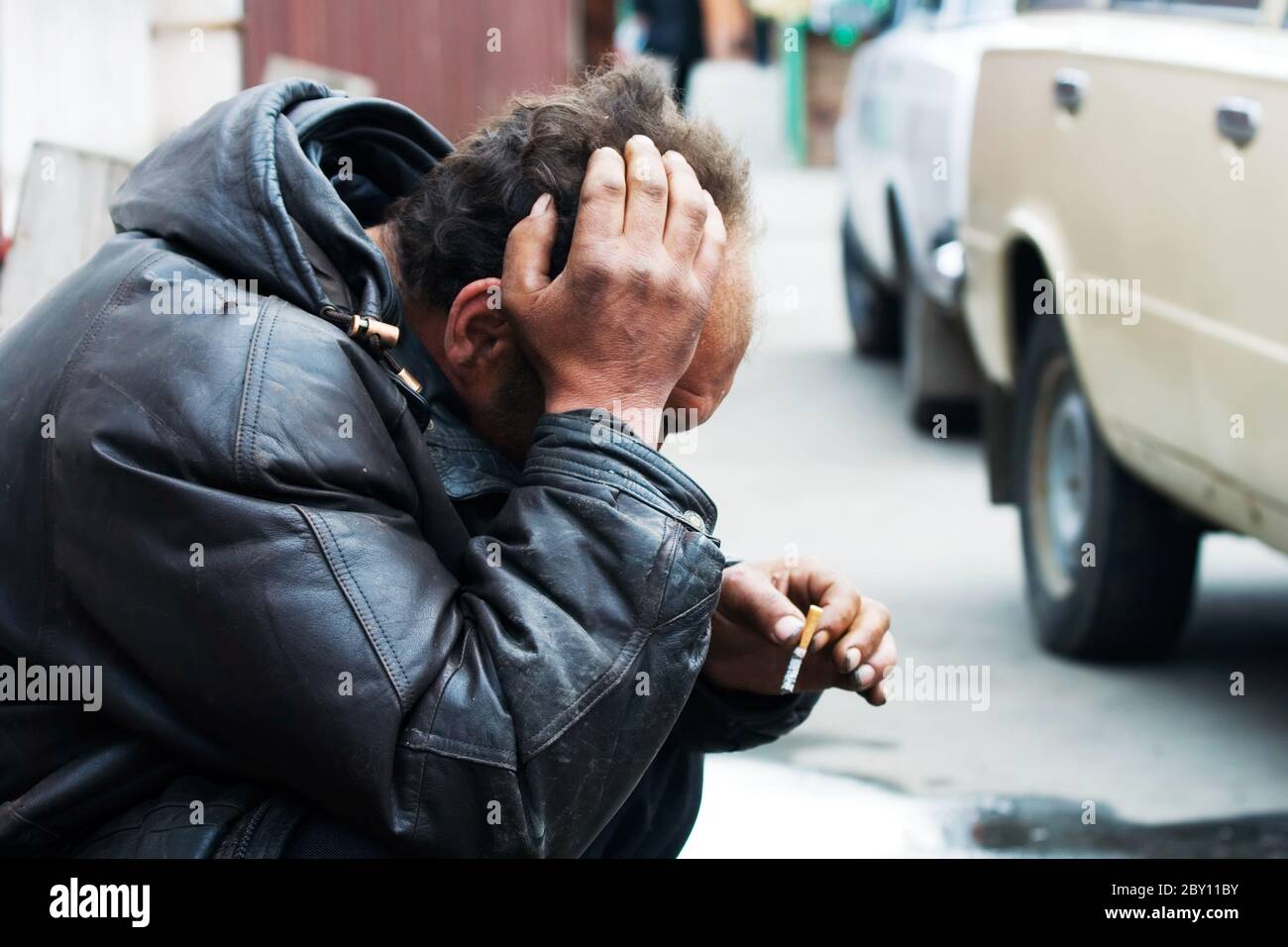 Homeless man in despair Stock Photo - Alamy