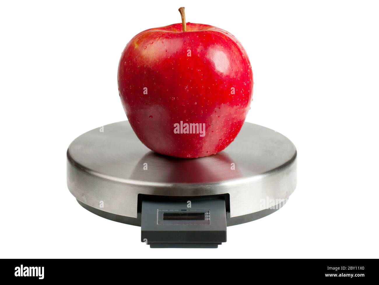 Apple on a scales Stock Photo - Alamy