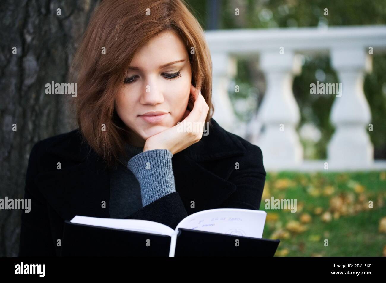 Beautiful girl reading a book Stock Photo - Alamy
