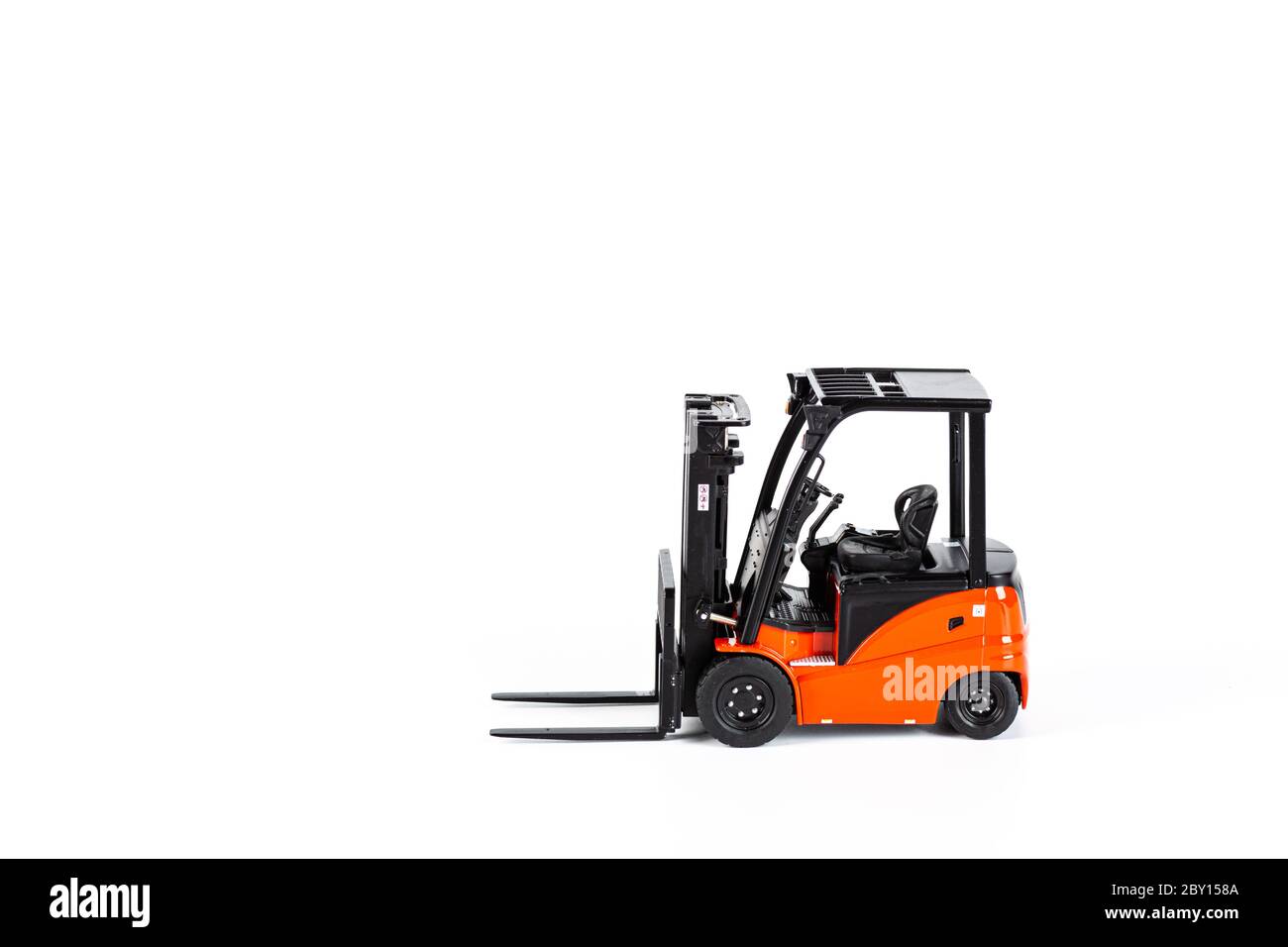 Red toy forklift loader isolated on white background. Copy Space for ...