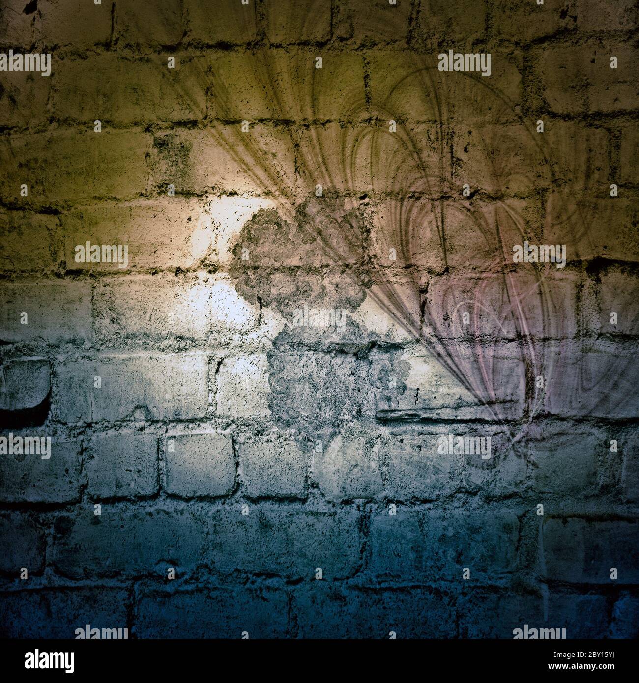 Graffiti on a repaired stone wall Stock Photo - Alamy