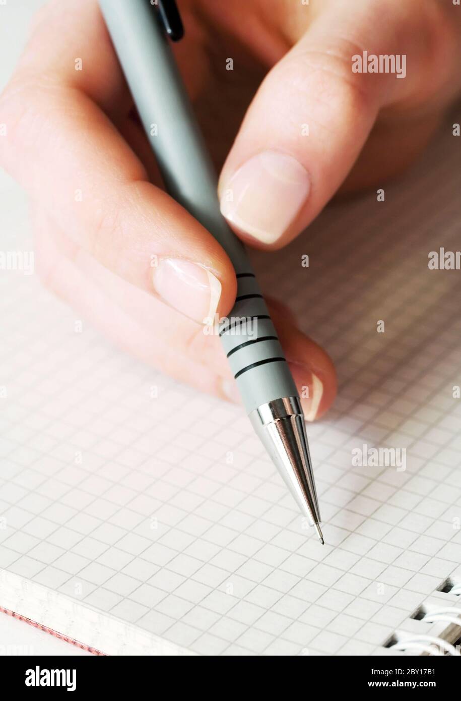 Female hands writing Stock Photo - Alamy