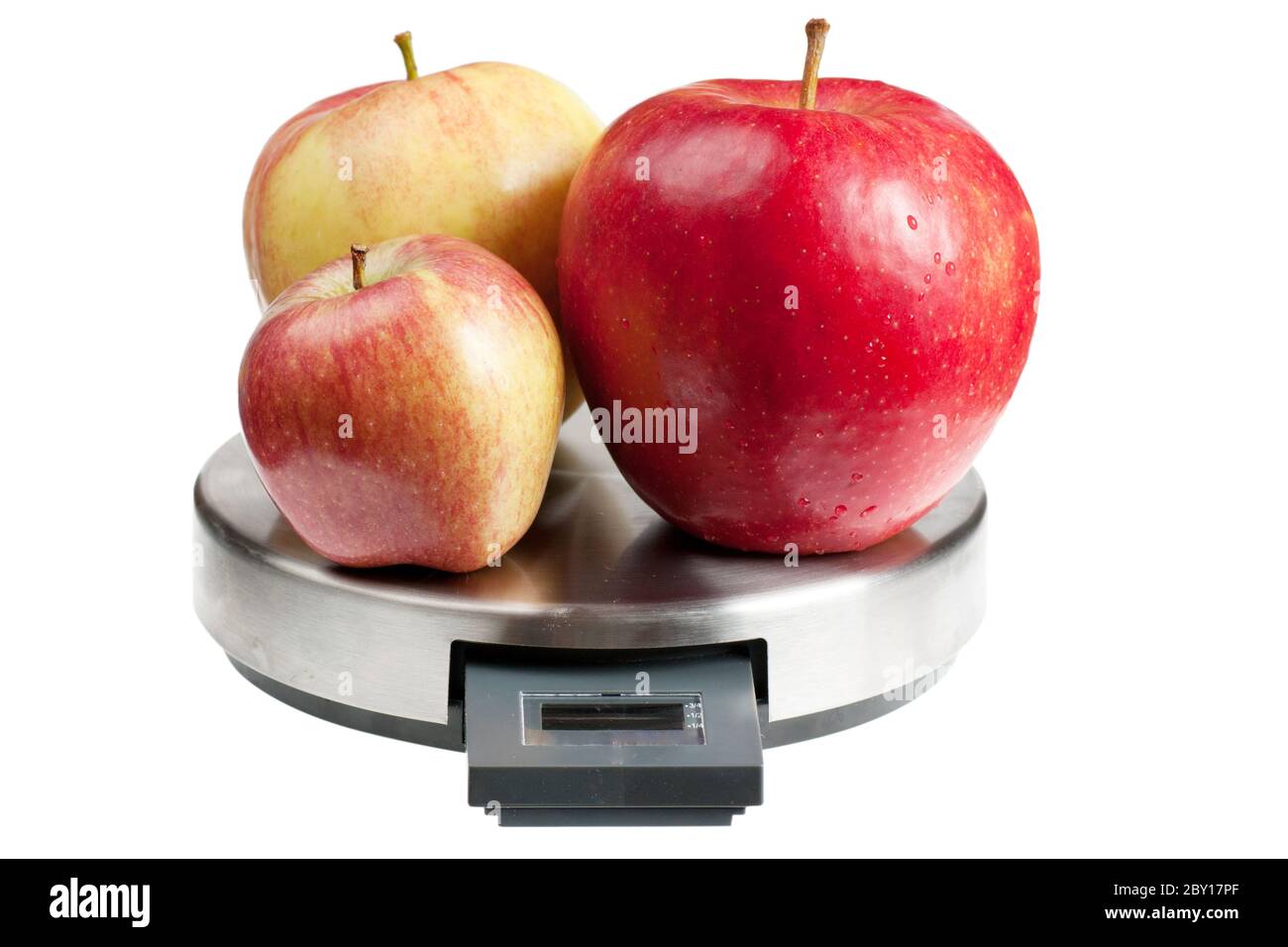 Apples on a scales Stock Photo - Alamy