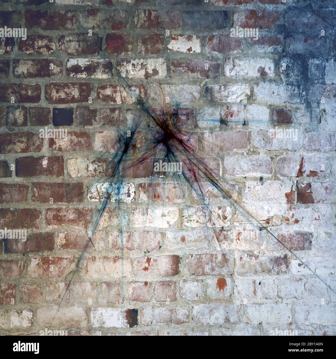 color bomb on a brick wall Stock Photo - Alamy