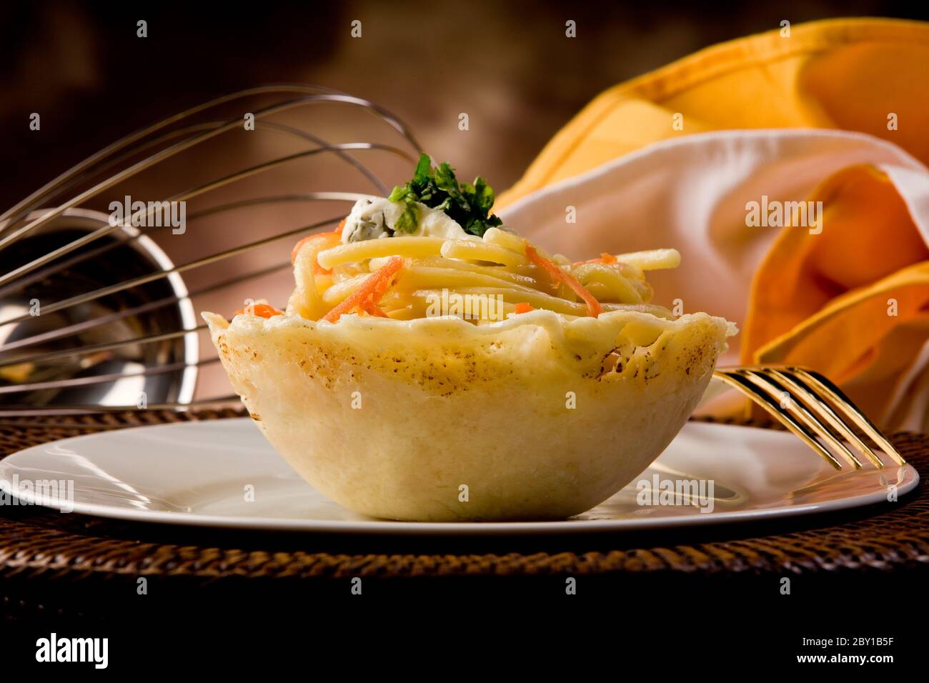 Pasta with Gorgonzola sauce inside parmesan waffle Stock Photo - Alamy