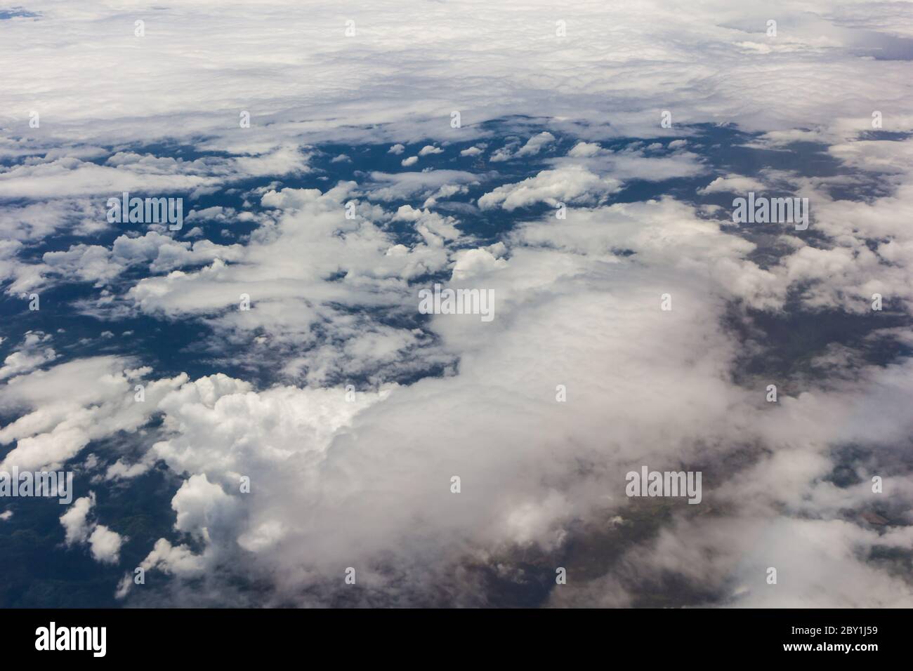 Blue sky with clouds background on the airplan in the morning time ...