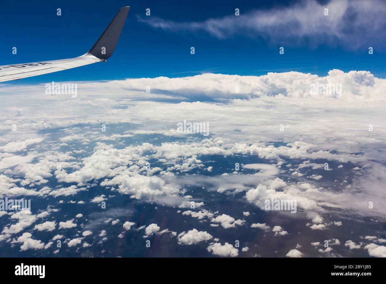 Blue sky with clouds background on the airplan in the morning time ...