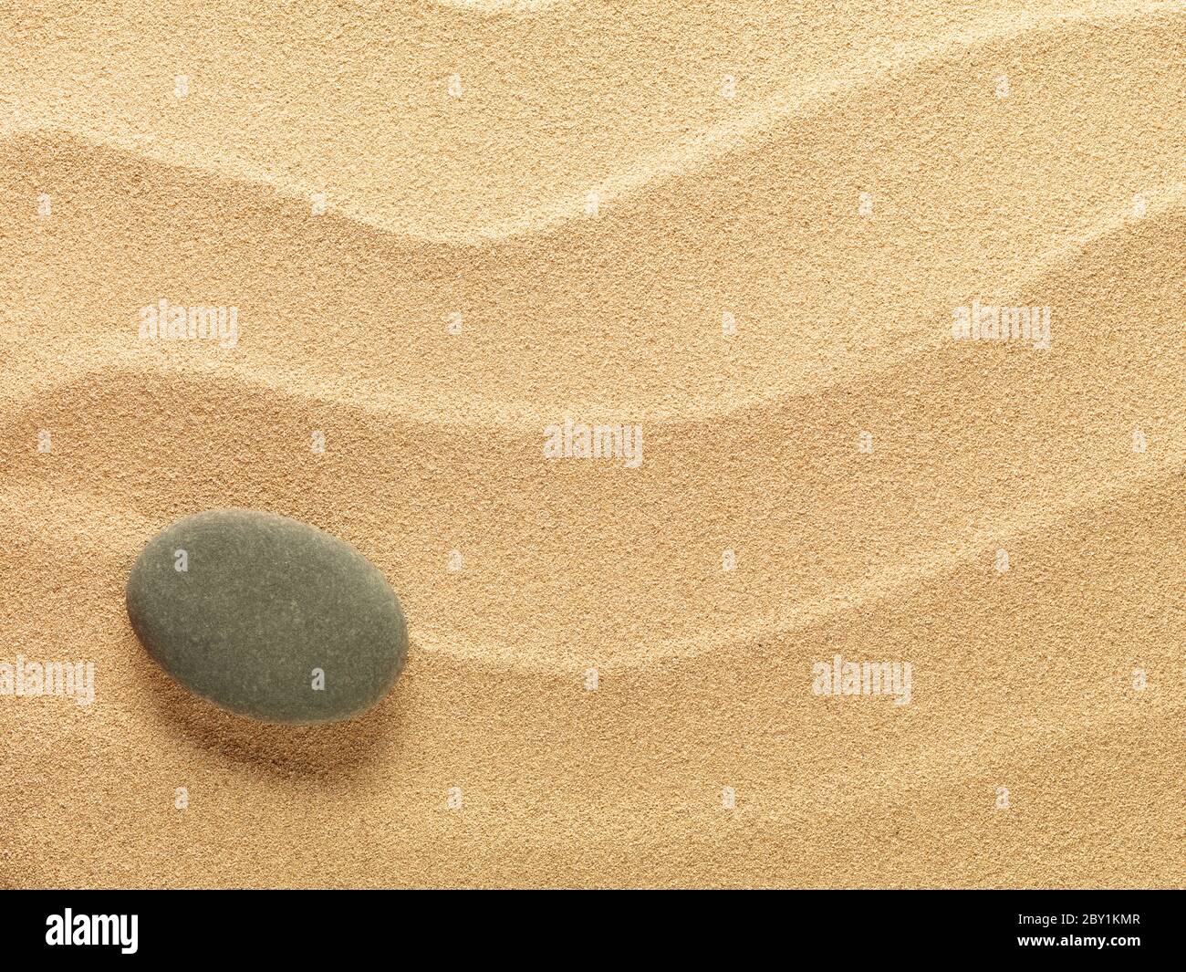 beach sand background with stone Stock Photo - Alamy