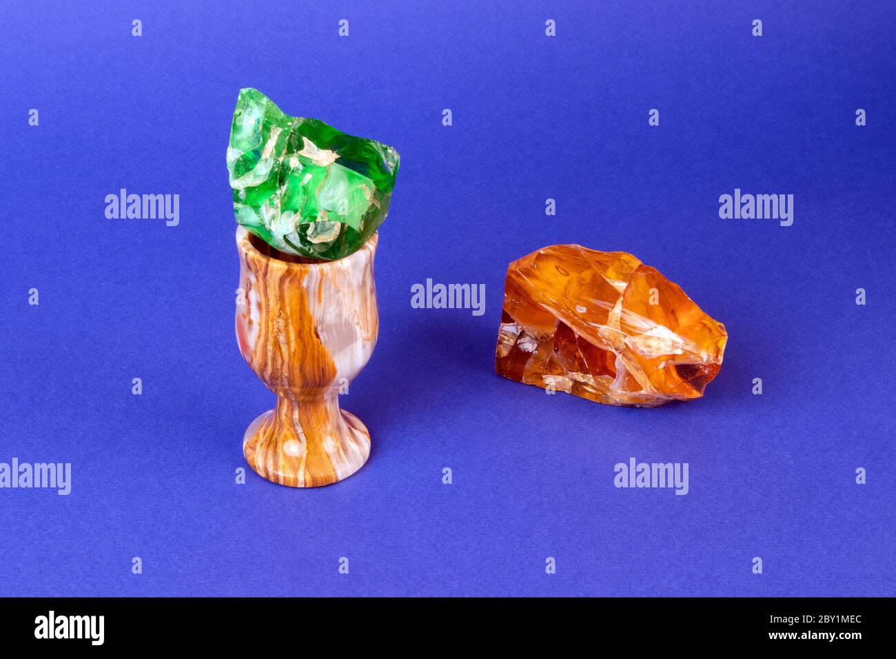 Small elegant onyx glass with green gem inside and piece of raw amber ...