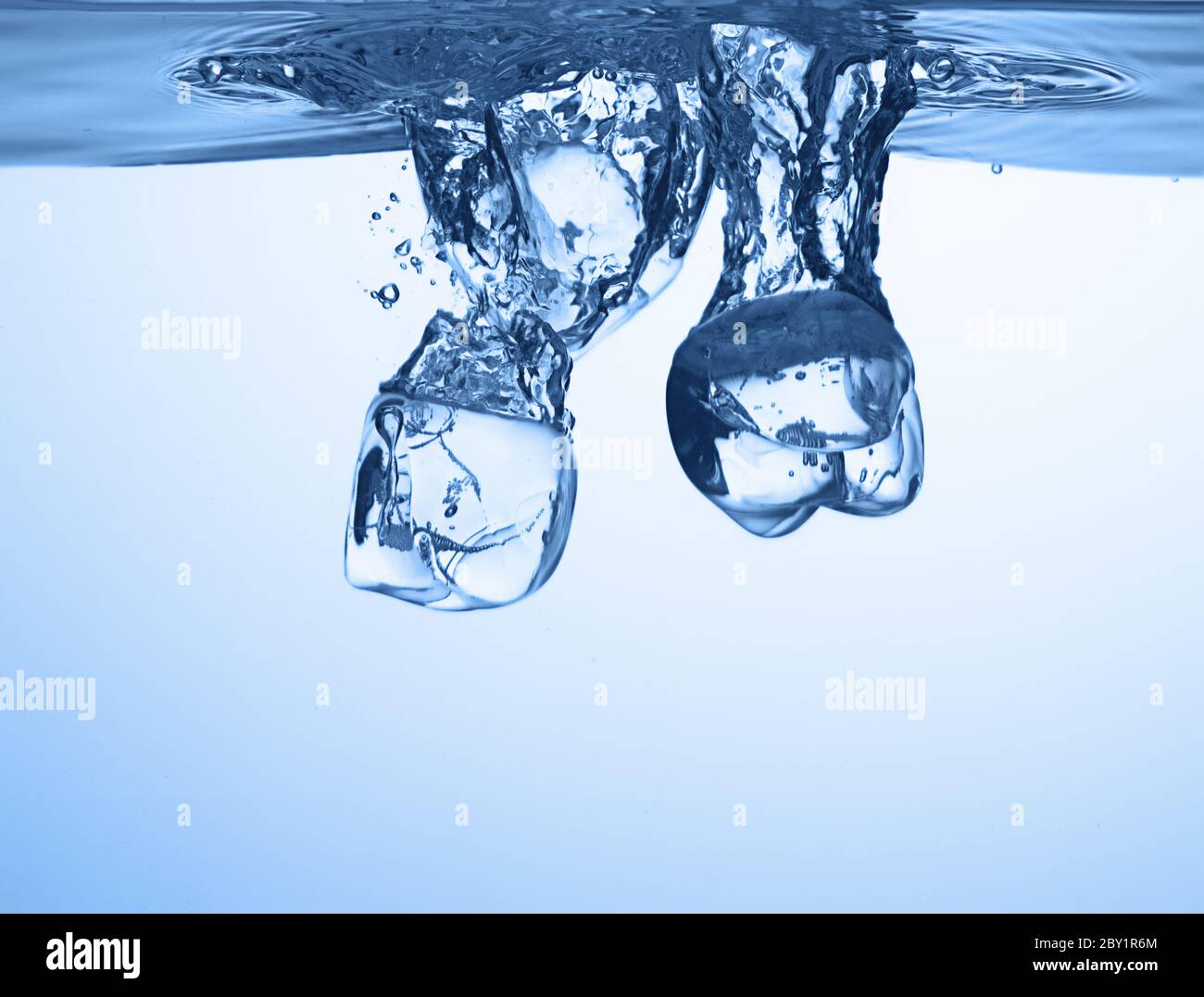 ice cube dropped Stock Photo - Alamy
