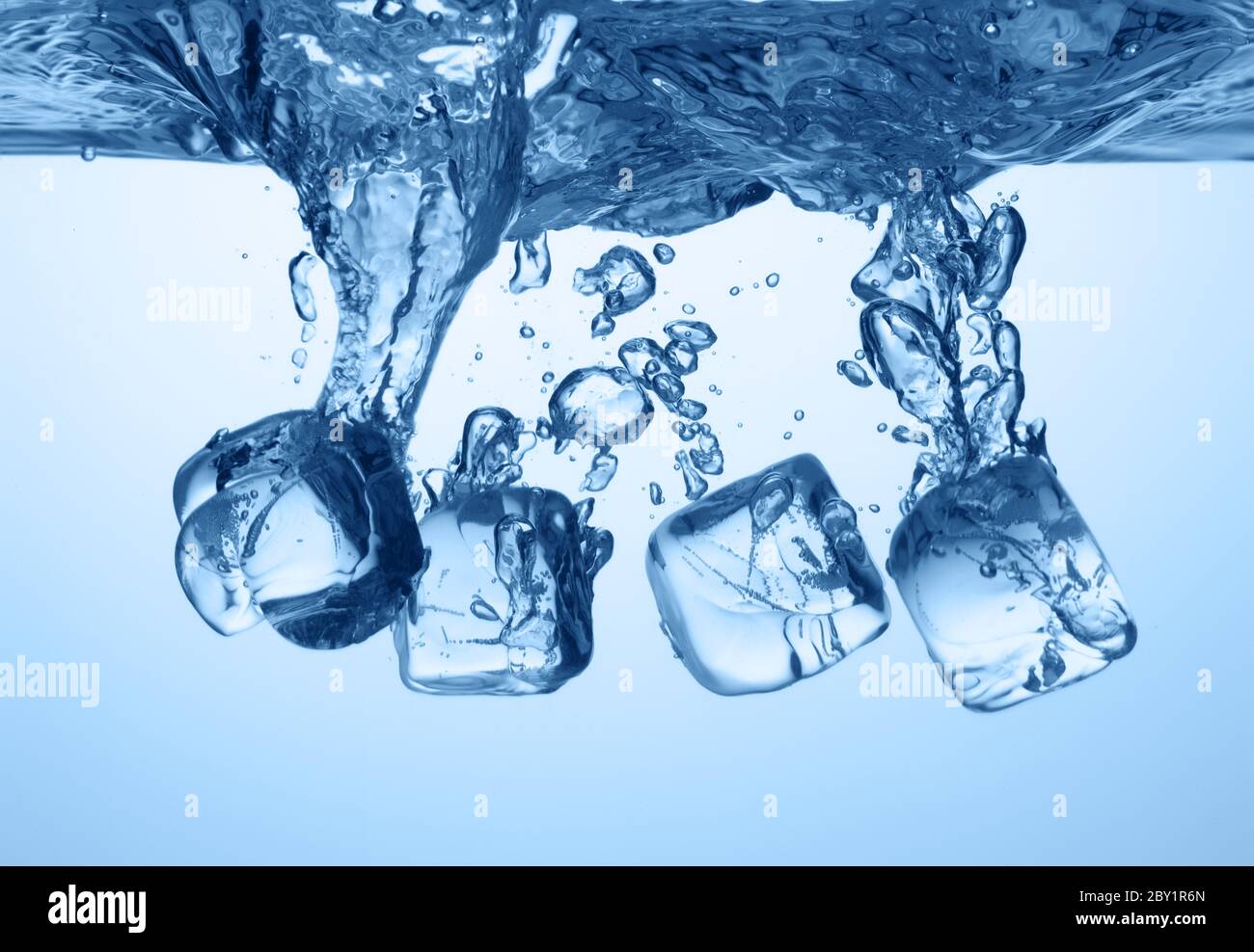 ice cube dropped Stock Photo - Alamy