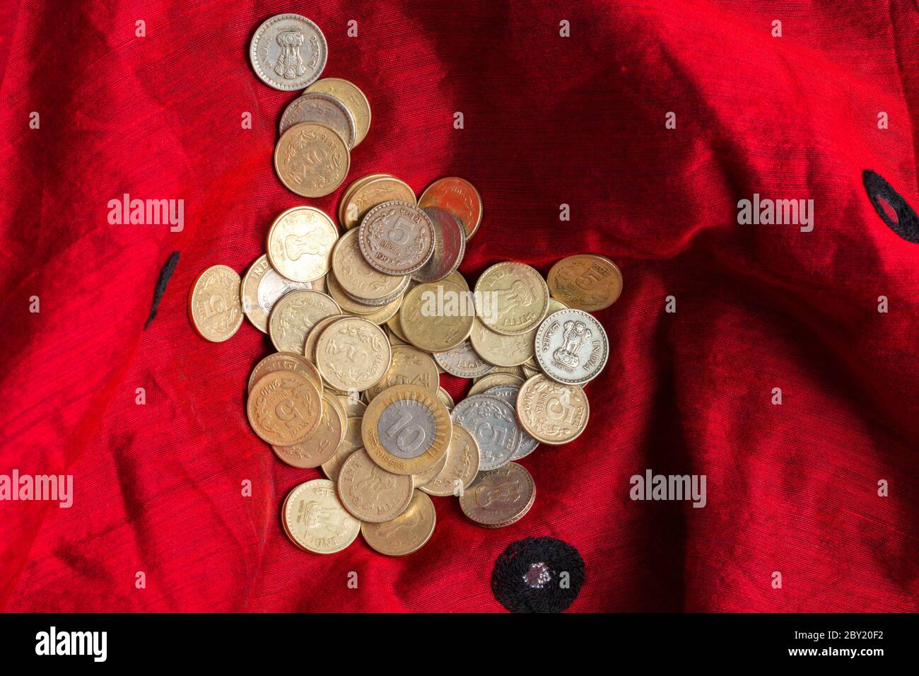 Indian five and ten rupee coins are kept in a red cloth Stock Photo - Alamy