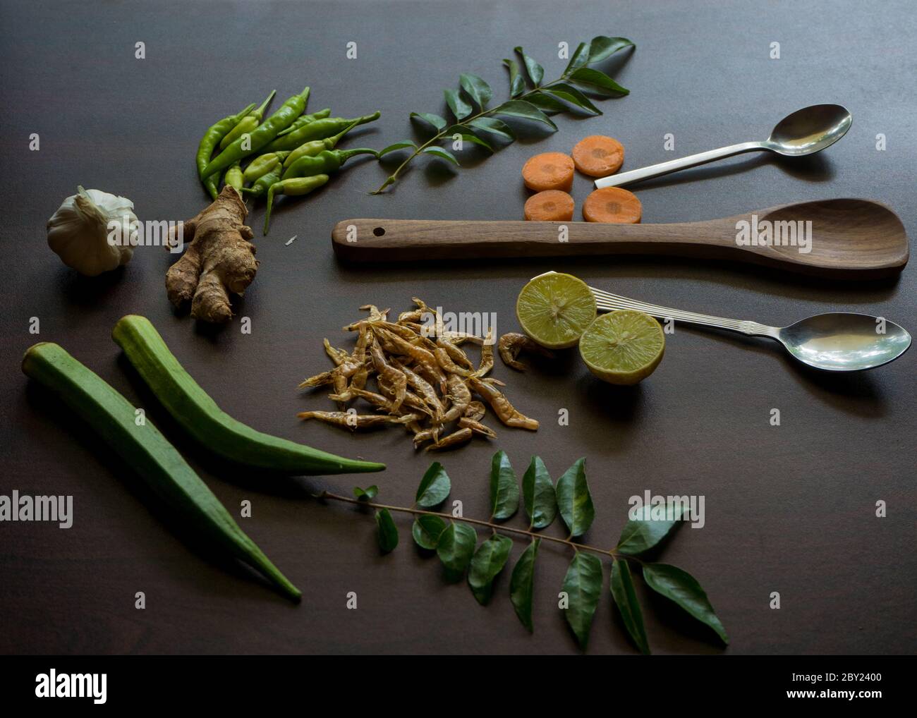 Beautifully garnished food ingredients on table top include various ...