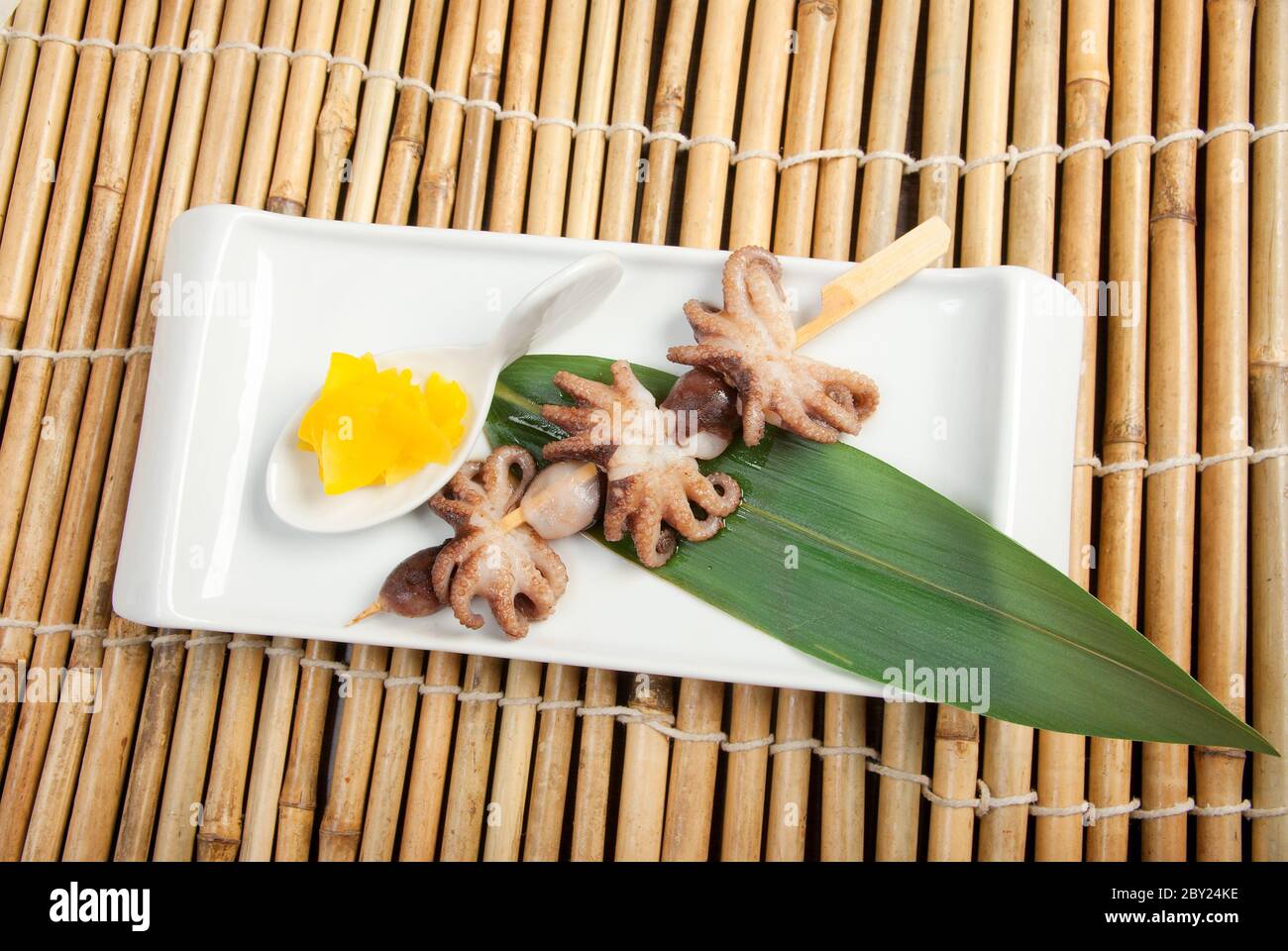 Japanese octopus skewered Stock Photo - Alamy