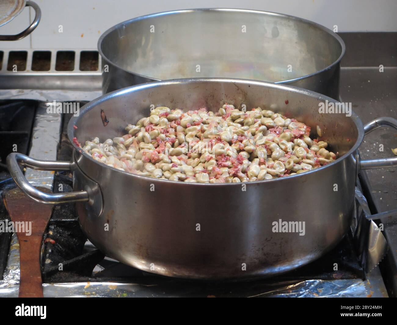 Large pot with prepared Ham and beans for tapas in Malaga bar Stock ...