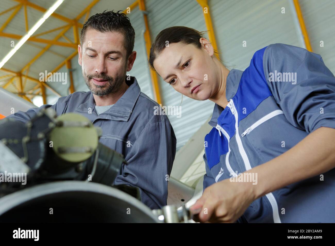 team of technicians working together Stock Photo - Alamy