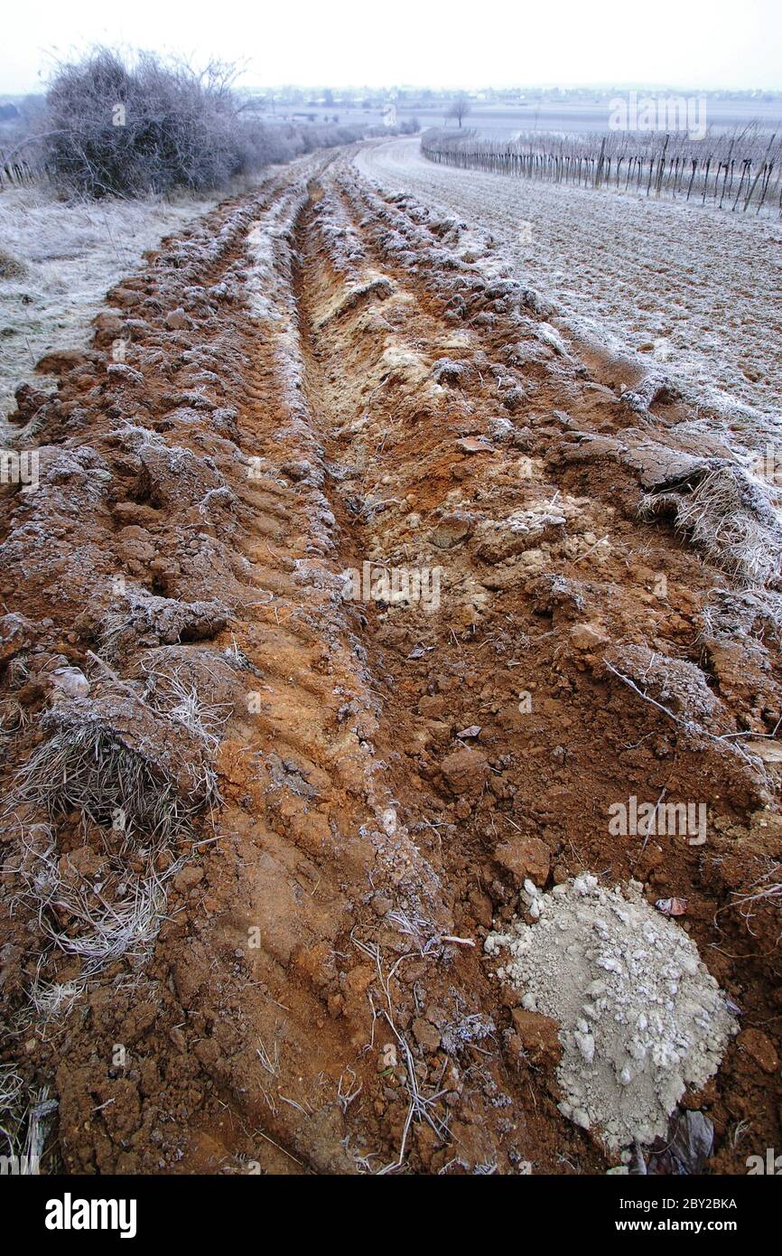 Furrow in the earth after plowing Stock Photo - Alamy