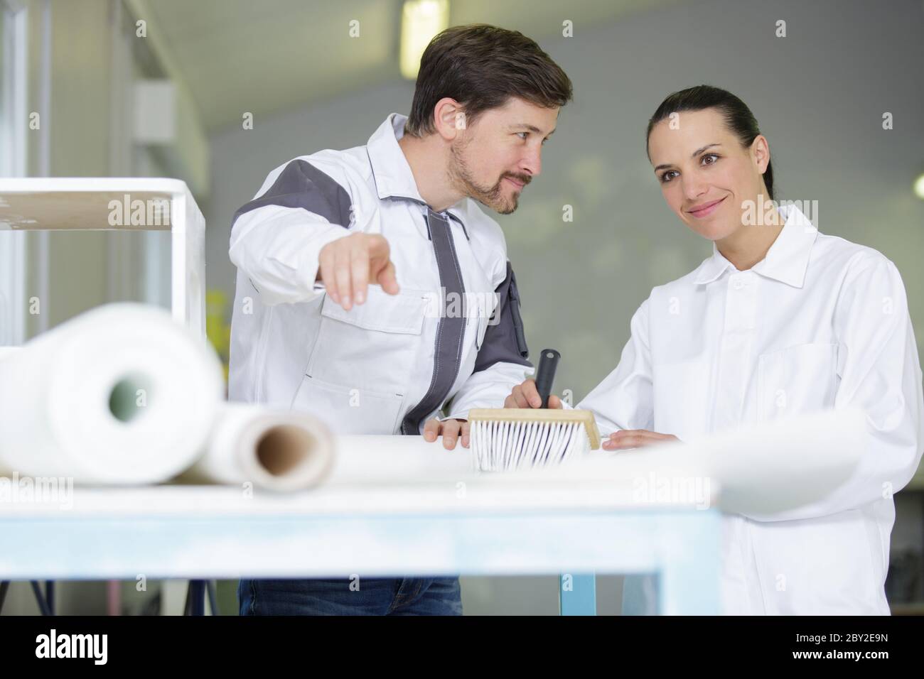 a team is preparing the wallpaper Stock Photo - Alamy