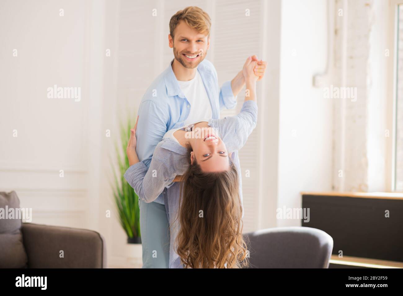 Young woman dancing feeling happy hi-res stock photography and images ...