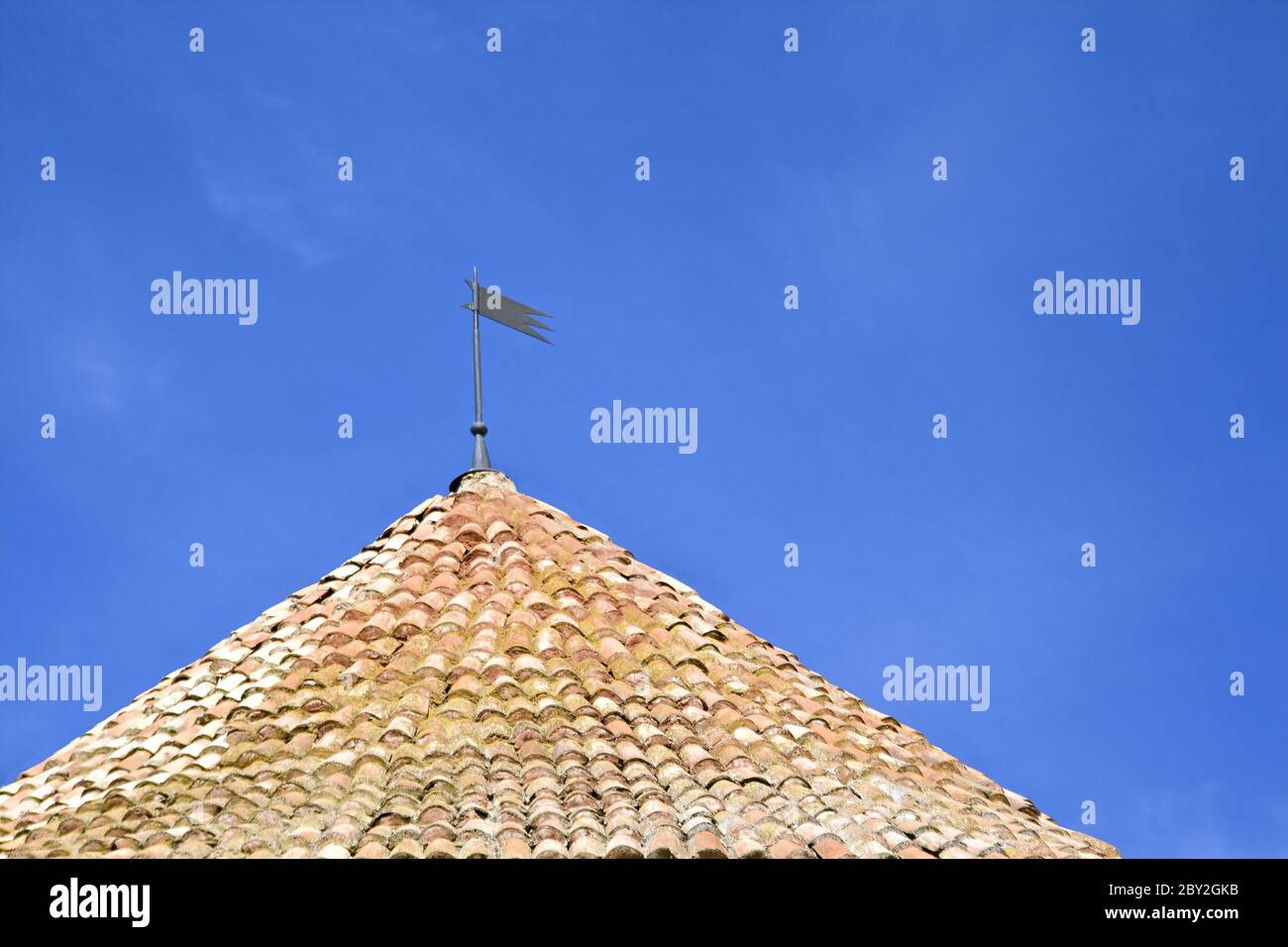 Red roof of a medieval tower Stock Photo - Alamy