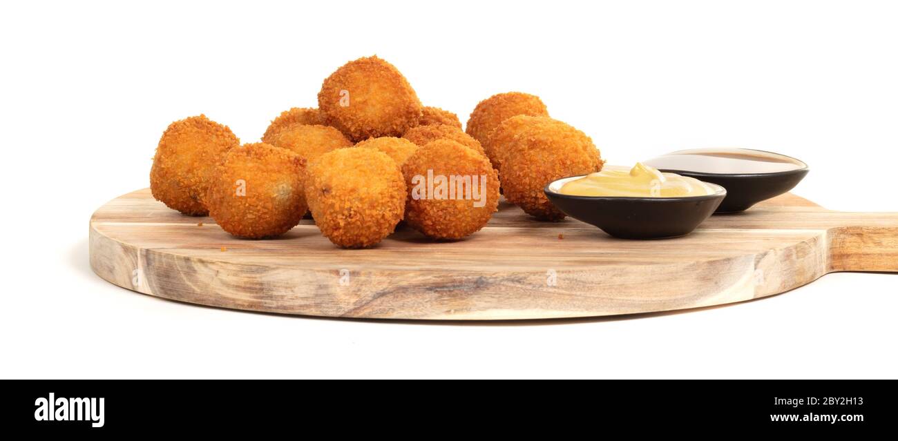 Dutch traditional snack bitterbal on a serving board, isolated Stock ...