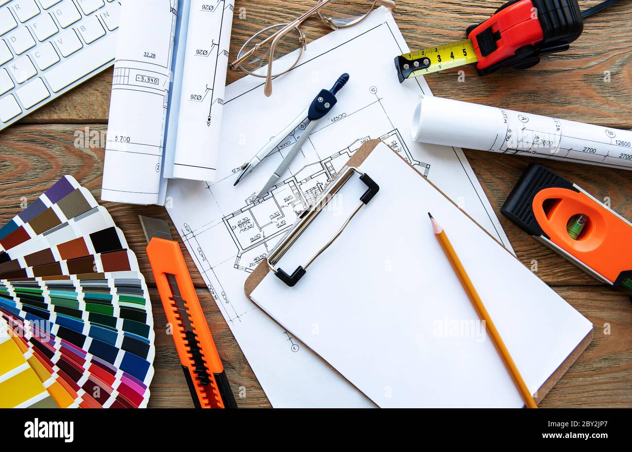 Architect workplace top view. Architectural project, blueprints ...