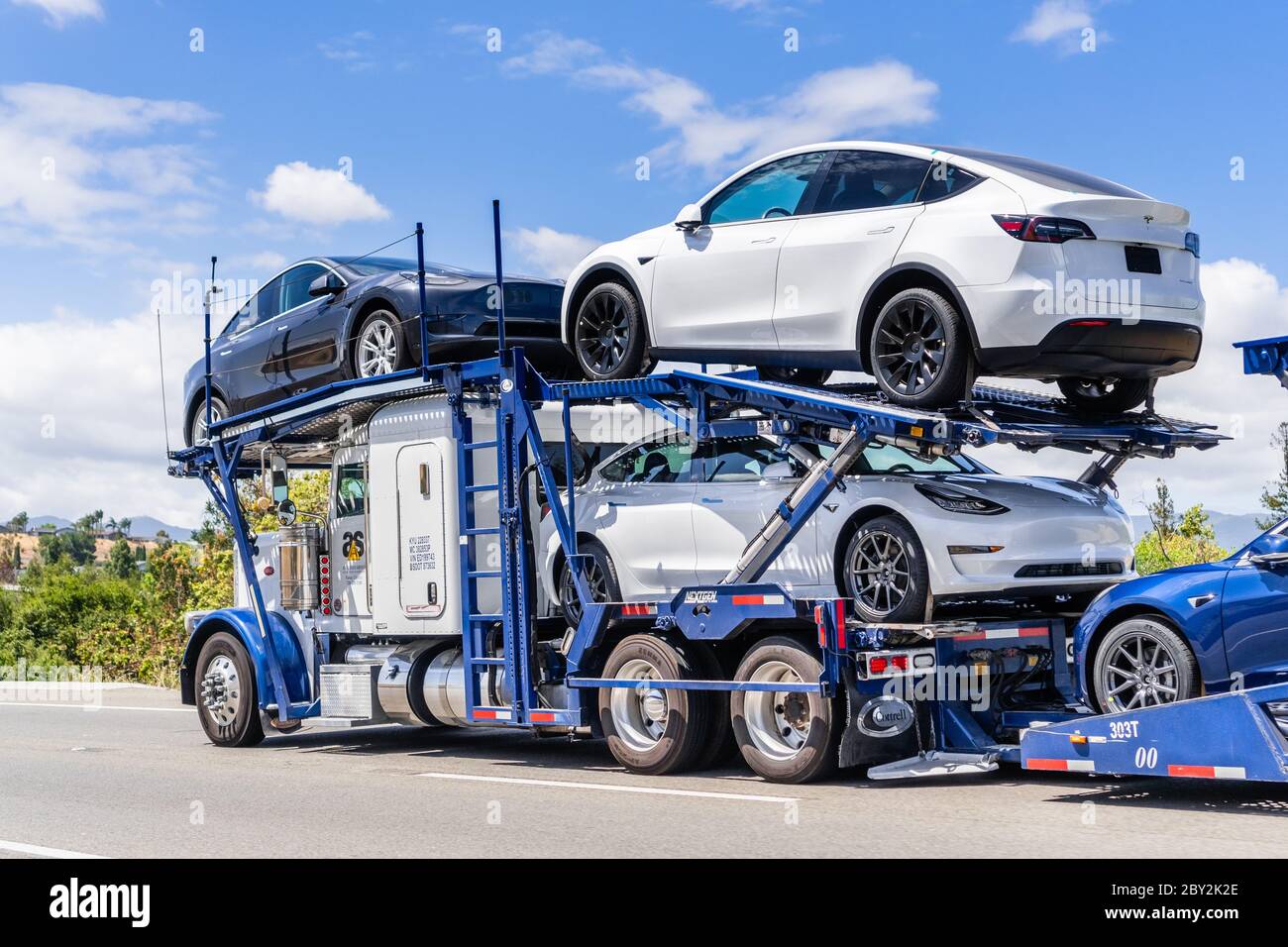 Jun 6, 2020 / CA / USA - Car transporter carries new Tesla Model Y (on ...