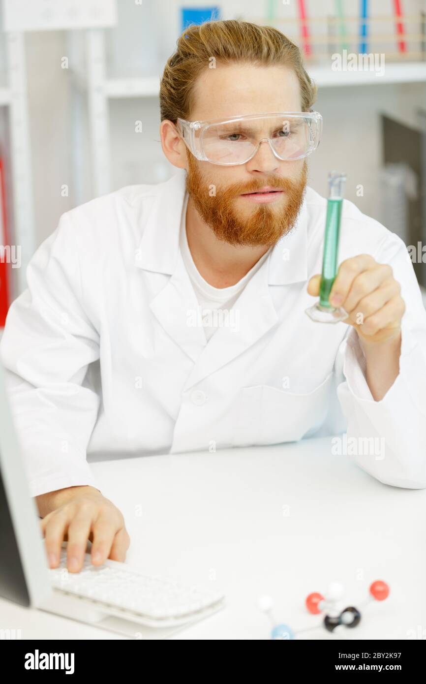 close up scientist holding pipette Stock Photo - Alamy