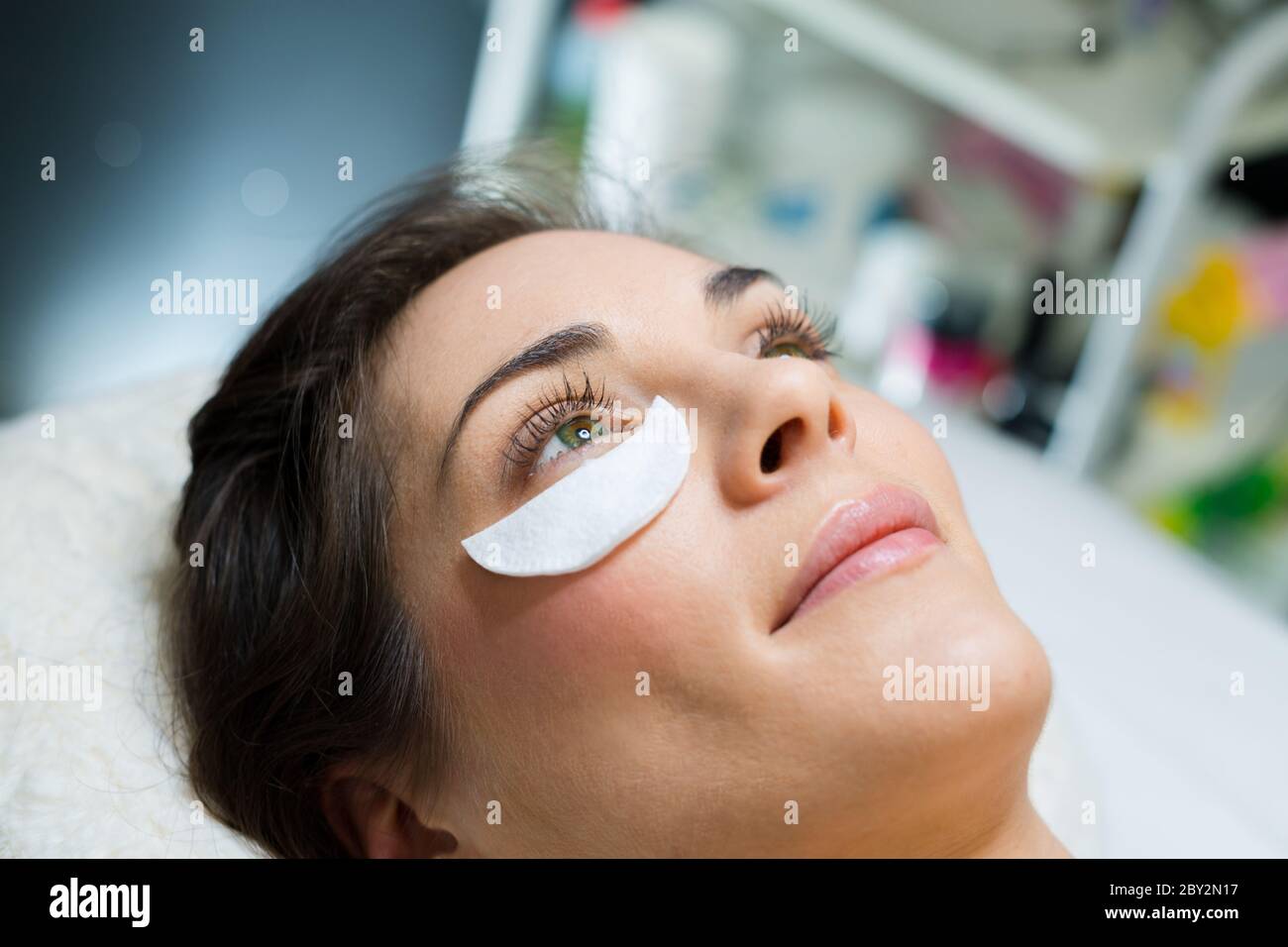 woman having an eye patch treatment for her eyes Stock Photo - Alamy