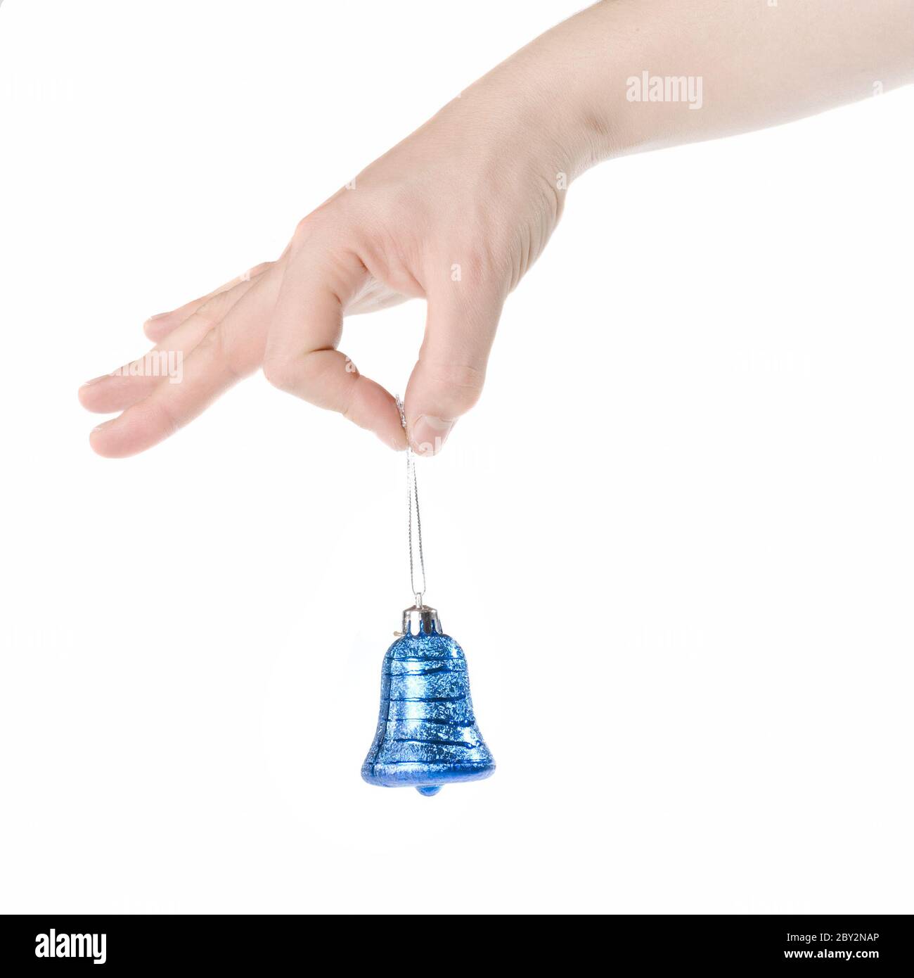 arm holding blue christmas bell isolated on white Stock Photo - Alamy