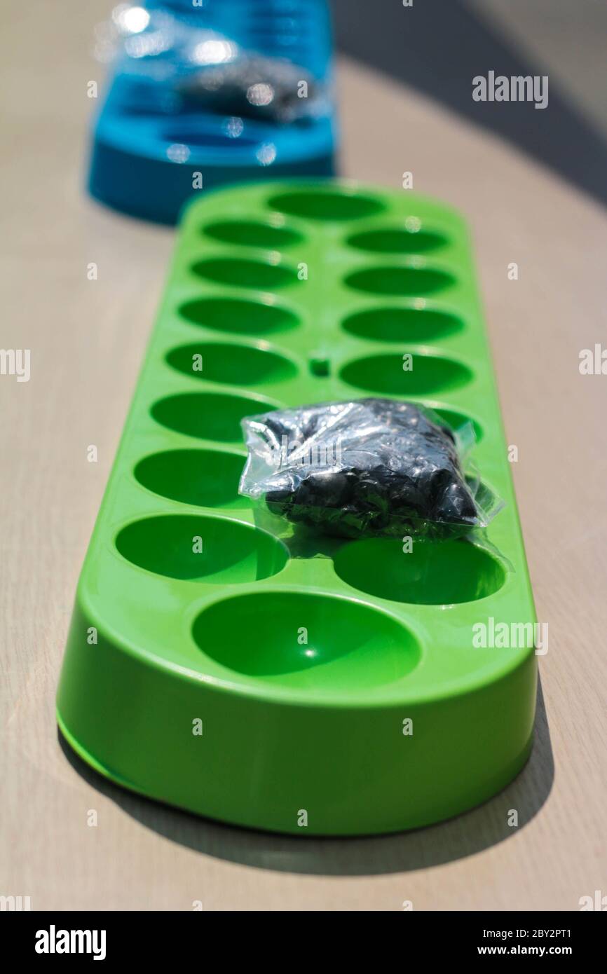 Indonesian traditional board game, Congklak with seeds. Southeast Asian ...