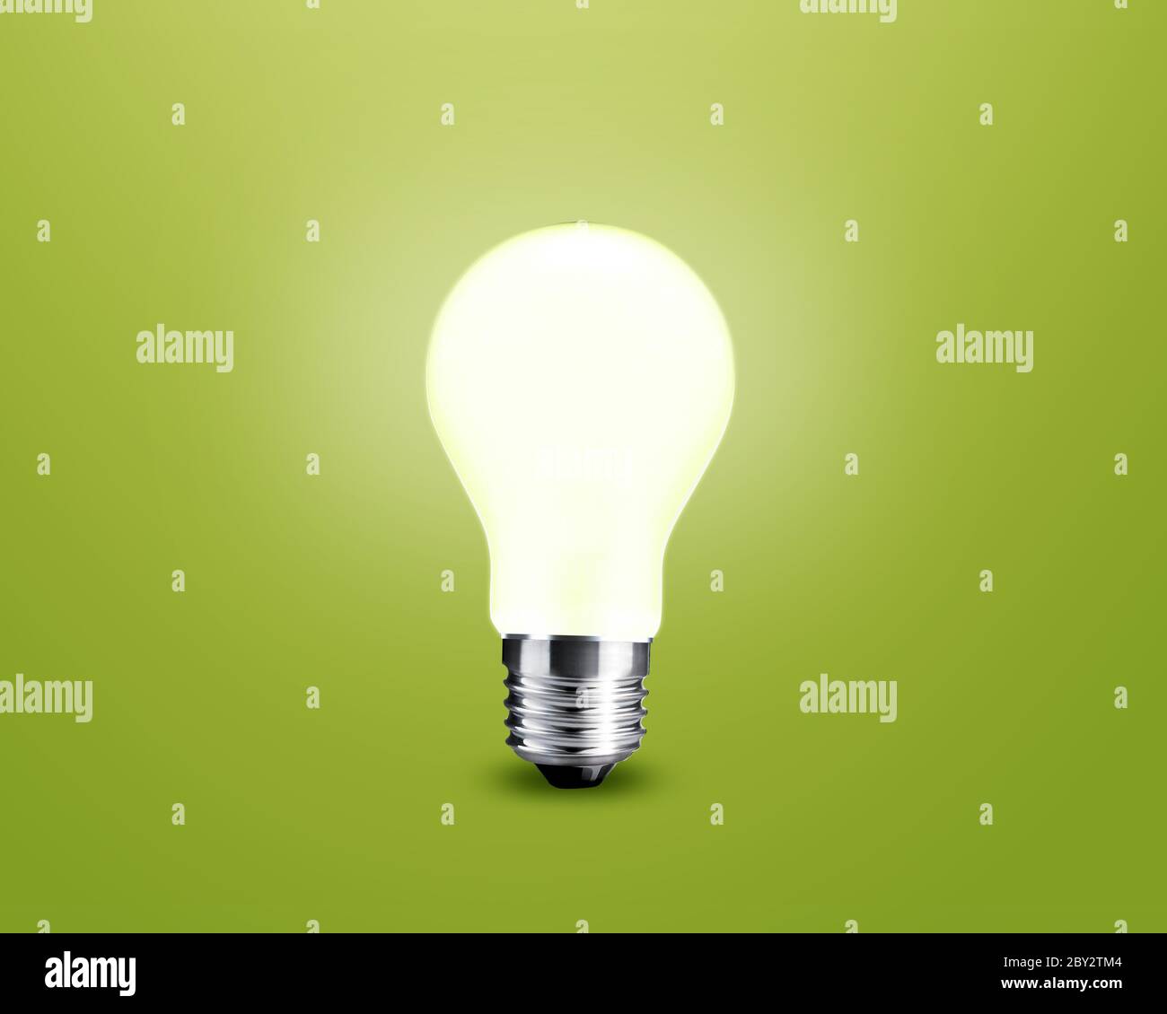 glowing Light bulb idea on green background Stock Photo - Alamy