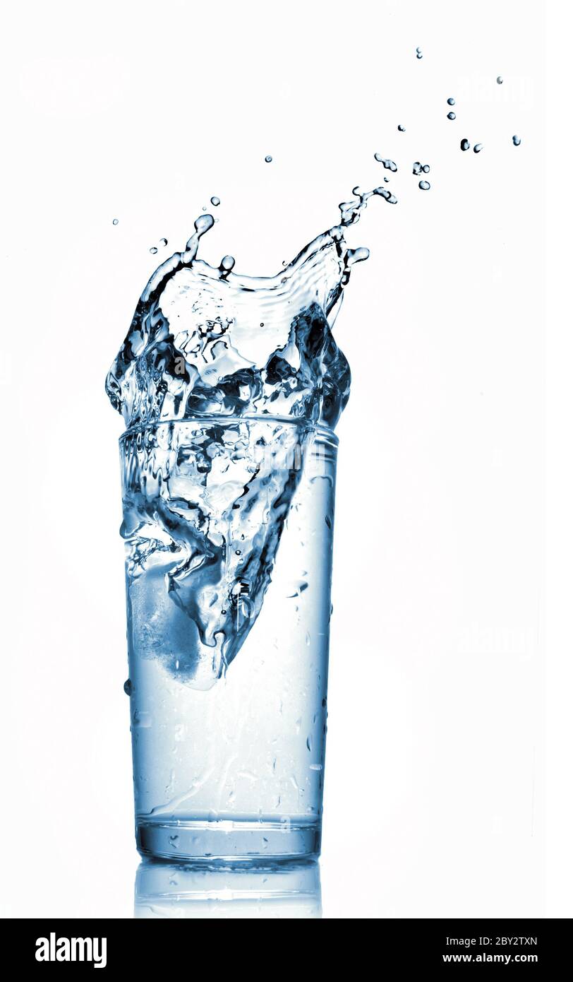 water splash in glass isolated on white Stock Photo - Alamy
