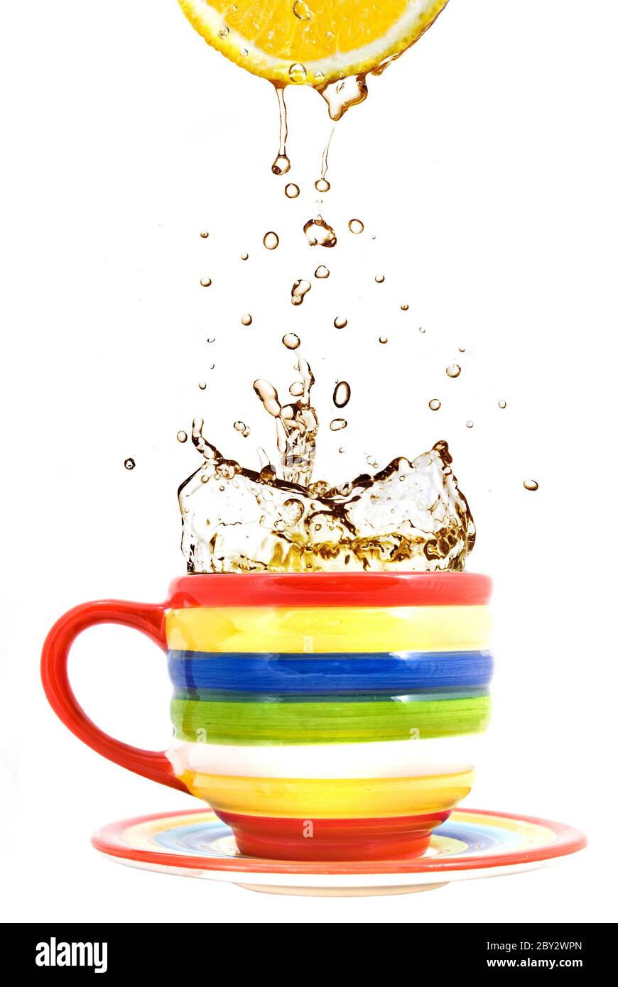 lemon, color cup and splash of tea isolated on white Stock Photo - Alamy