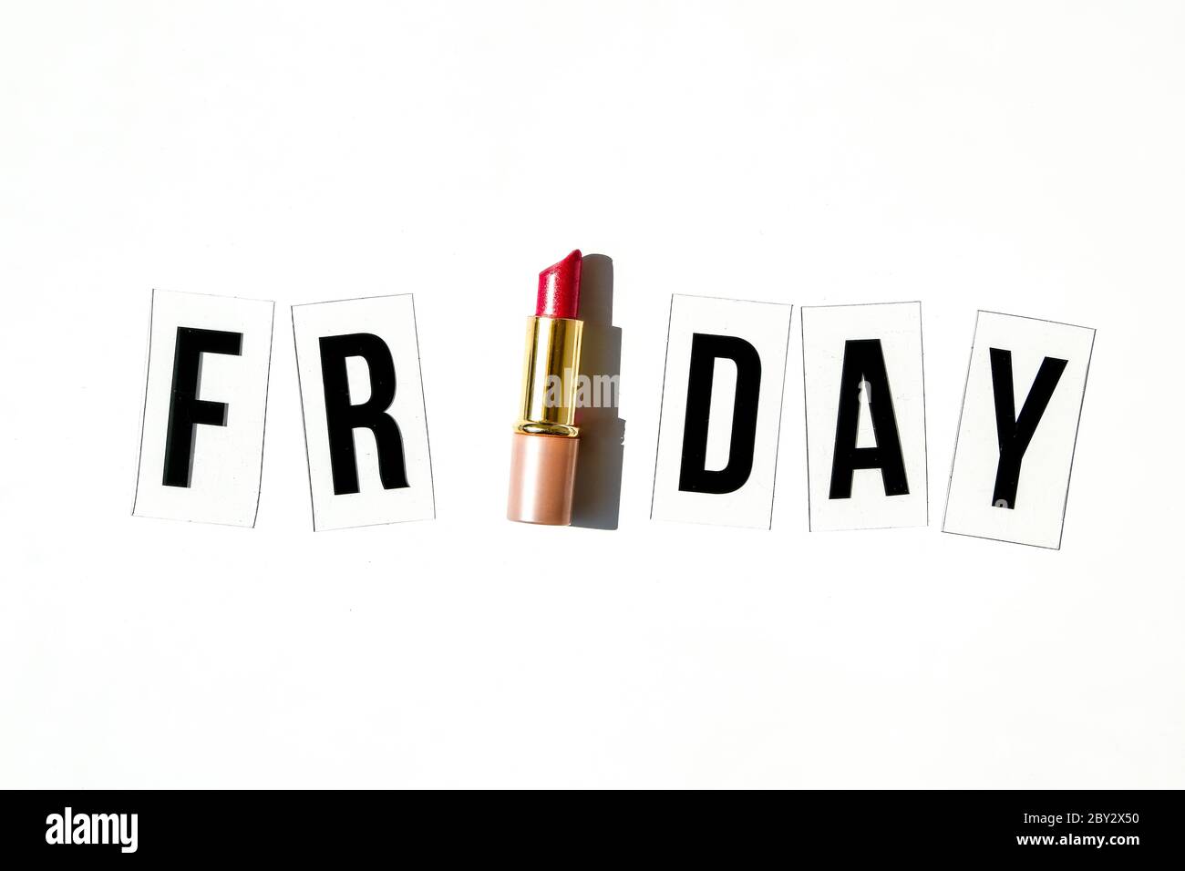 Red lipstick with Friday text, Creative concept photo of lipstick with ...