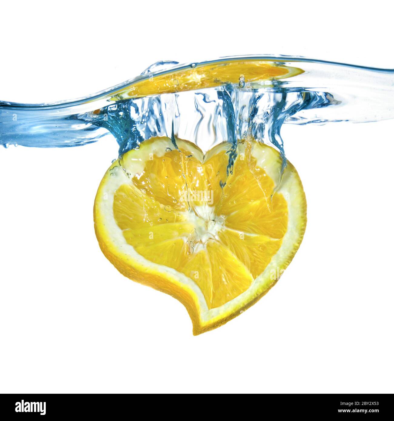 heart from lemon dropped into water isolated on white Stock Photo - Alamy