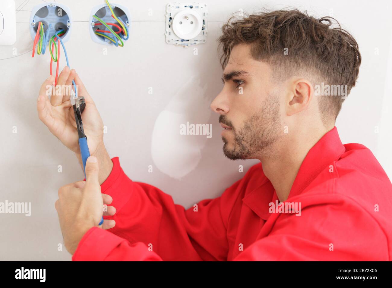 man working on power socket Stock Photo - Alamy